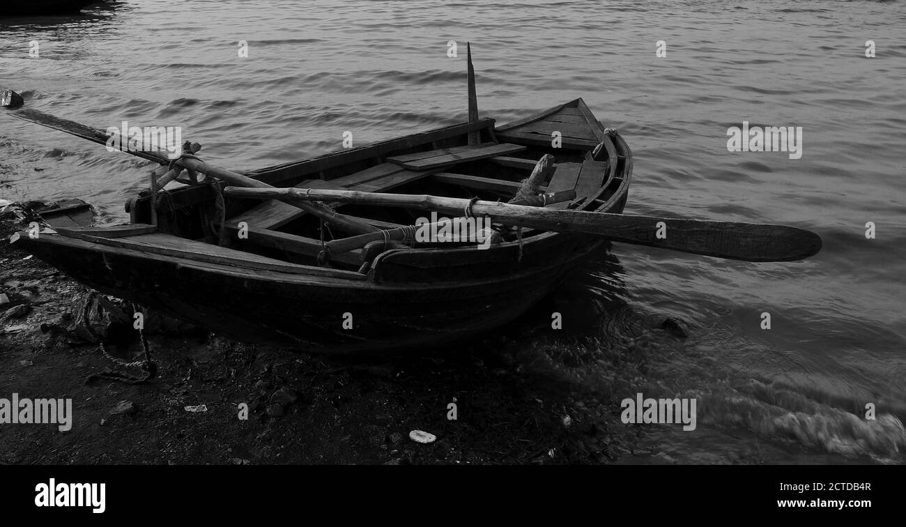 old Indian fishing boat at river side Stock Photo - Alamy
