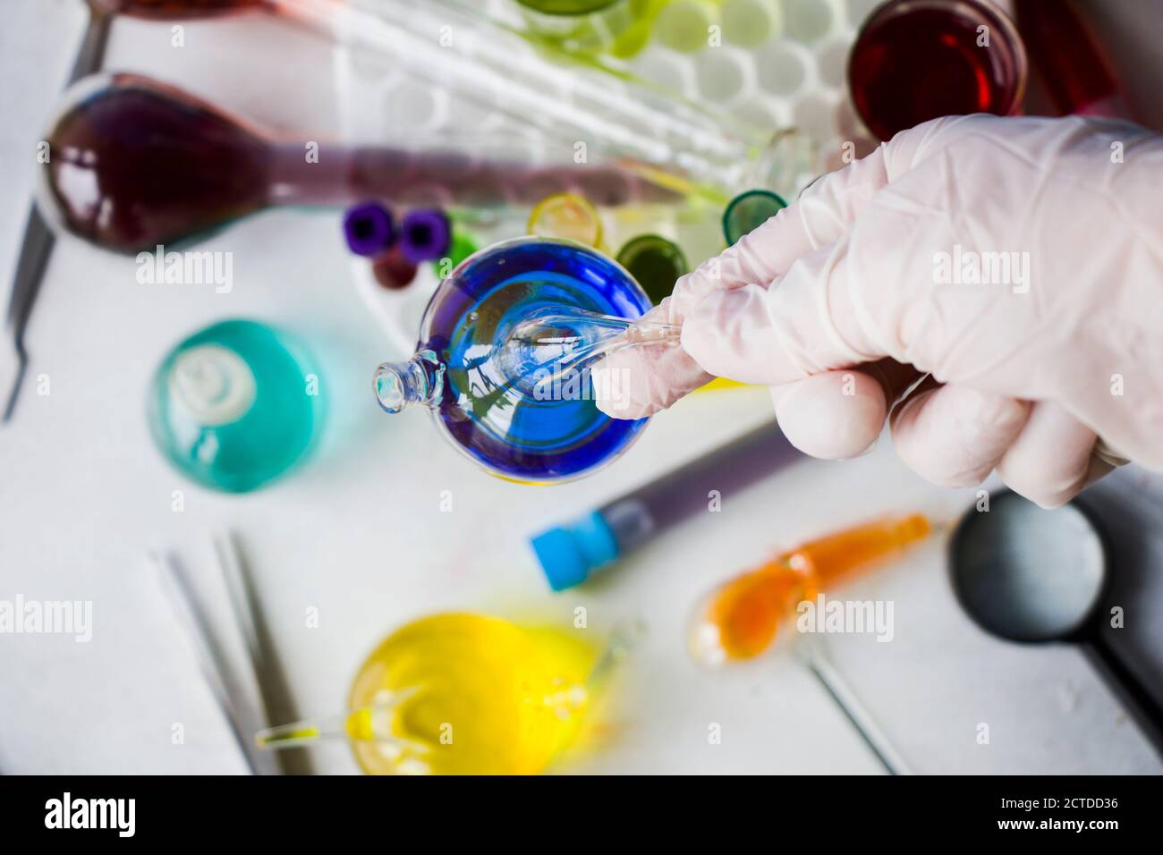 Laboratory instruments, glassware and reagents, colorful liquid ...