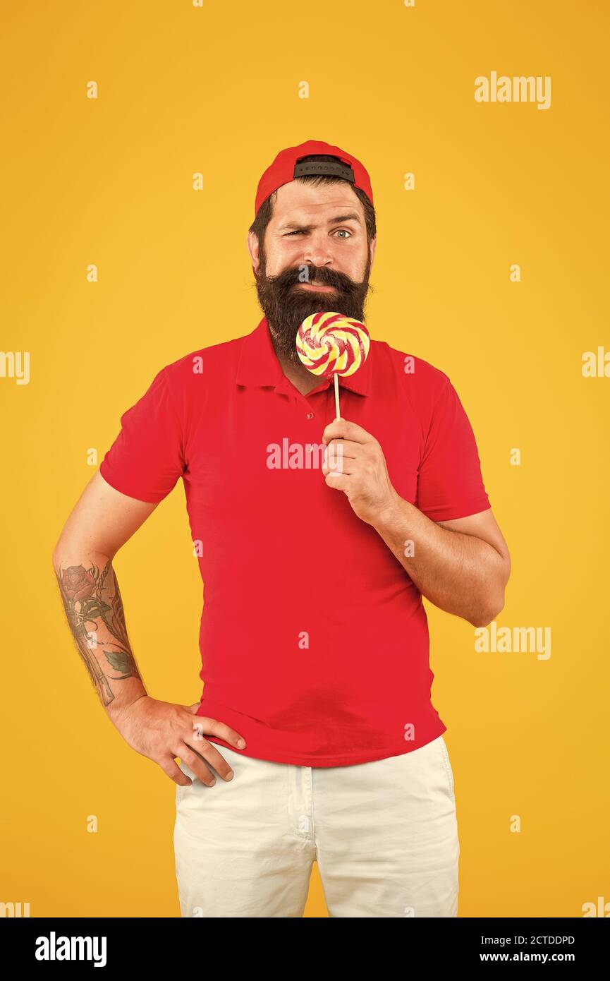 Funny man licking lollipop. Bearded man with lollipop. candy shop ...