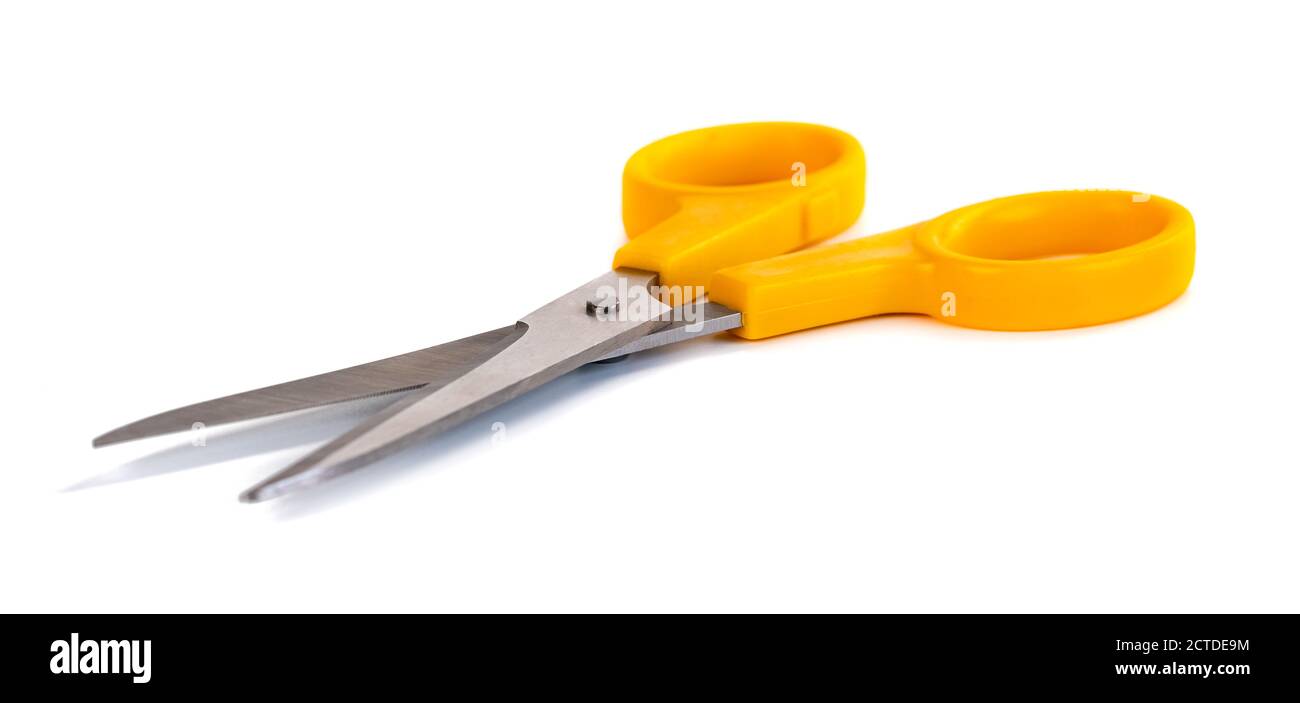 Yellow scissors isolated on a white background Stock Photo - Alamy