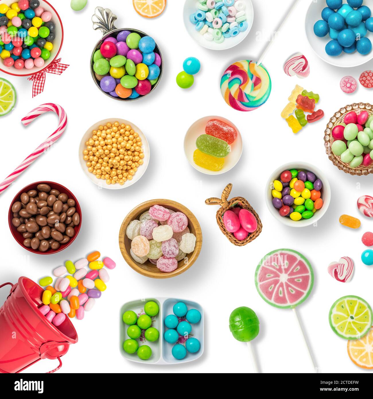 Candies, chocolates and lollipops on a white background background ...