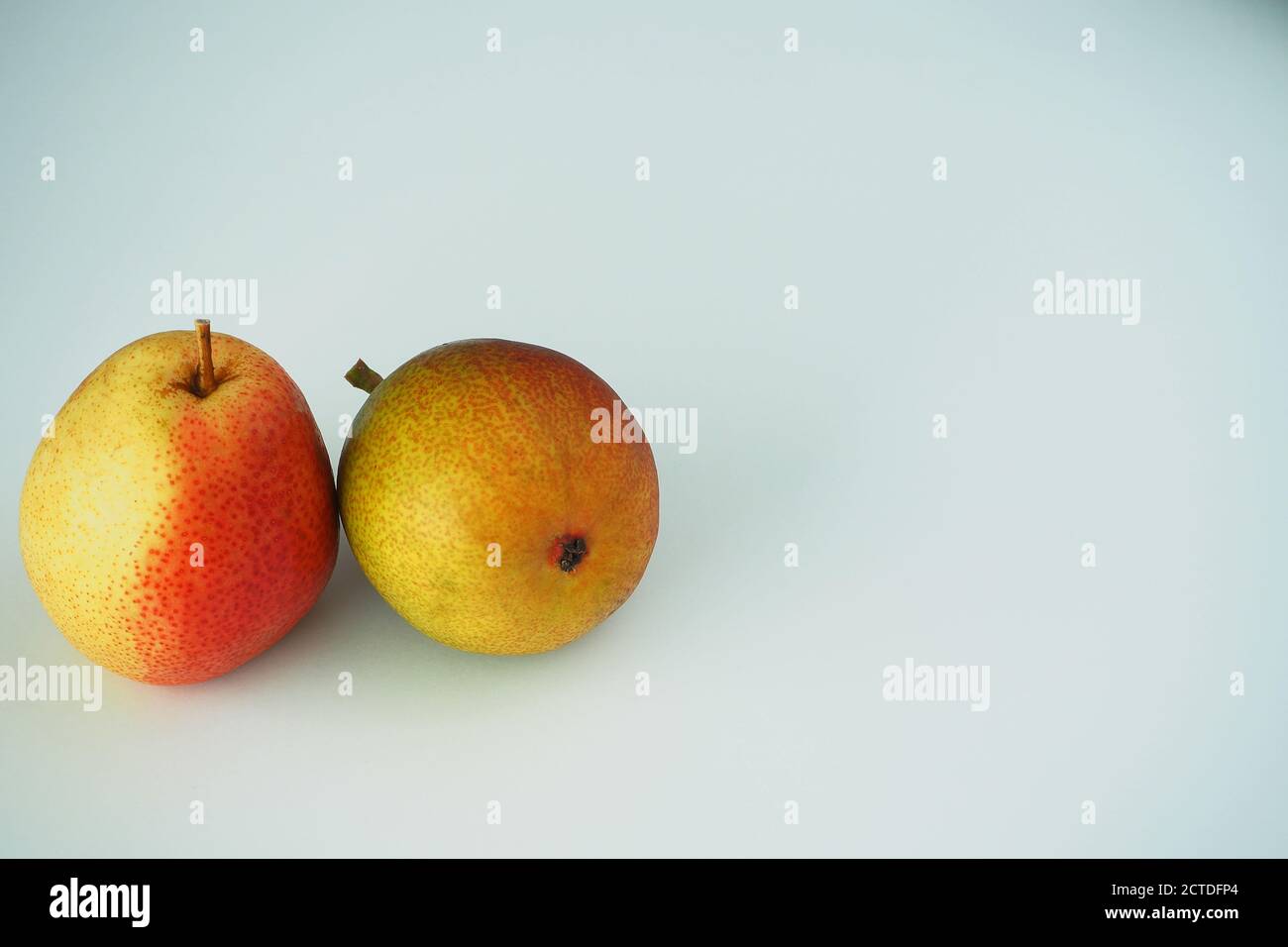 Fruit. Two pears close-up on a white background Stock Photo - Alamy
