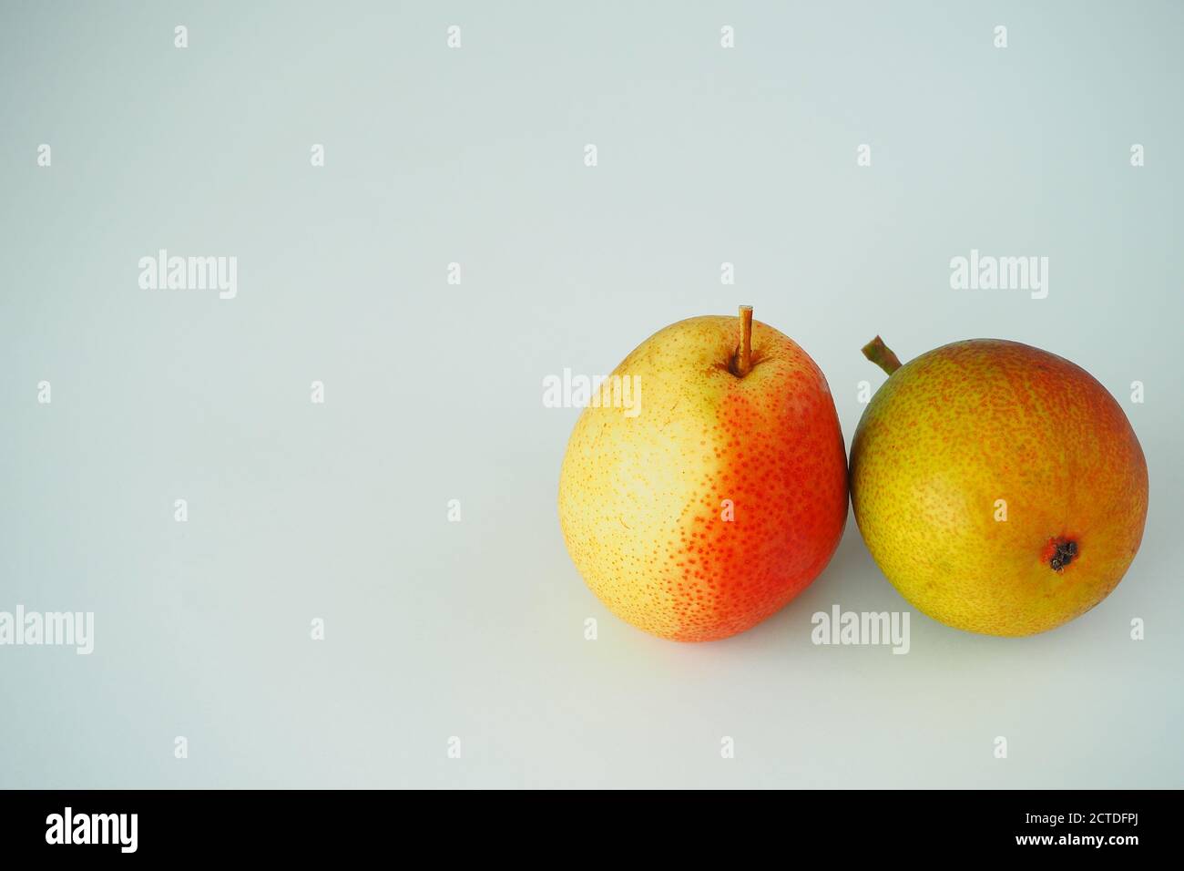 Fruit. Two pears close-up on a white background Stock Photo - Alamy