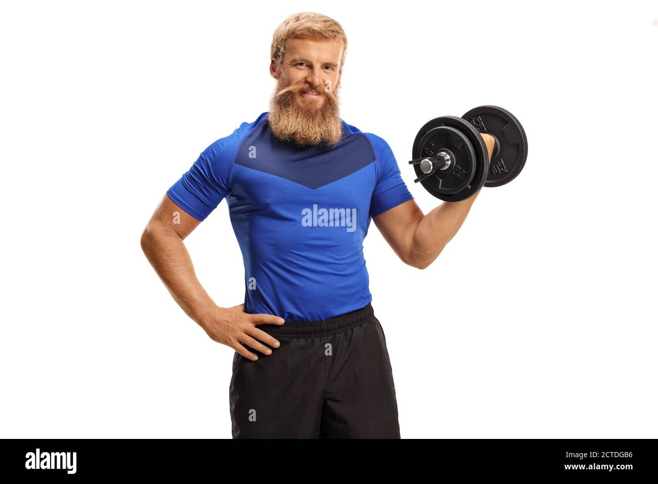 Young man with beard and moustache exercising with dumbbell in one hand ...