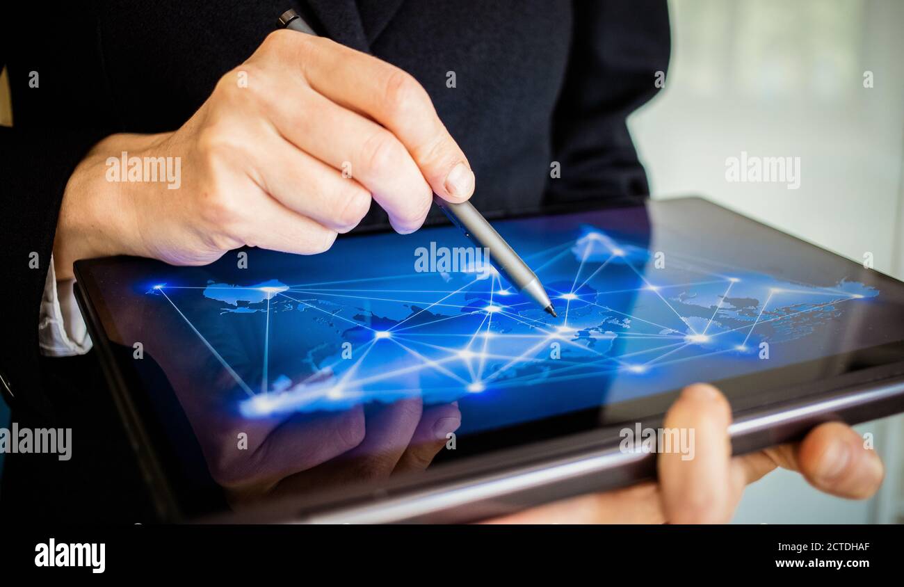 hand touching tablet screen global connection Stock Photo - Alamy