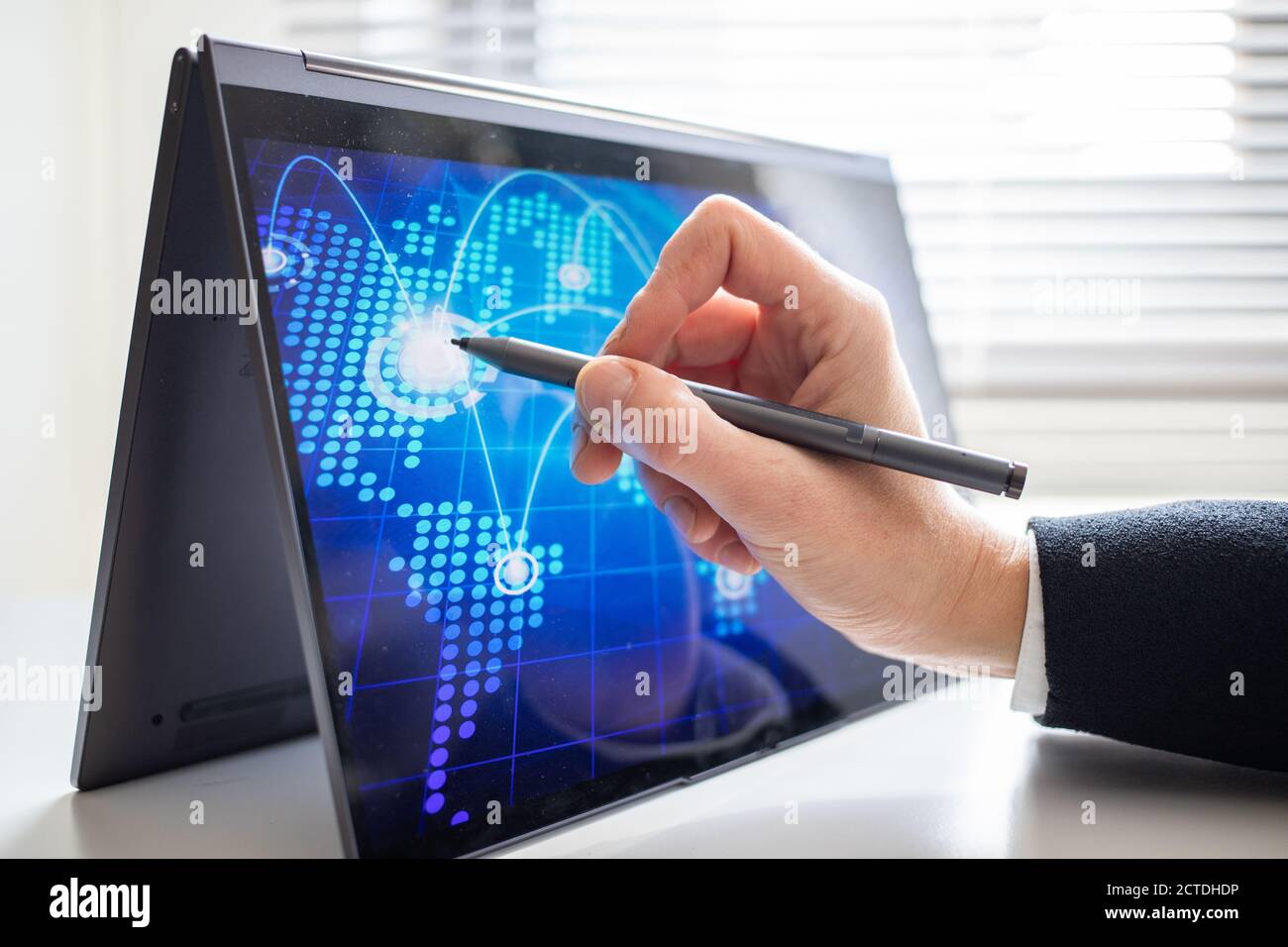 hand touching tablet screen global connection Stock Photo - Alamy