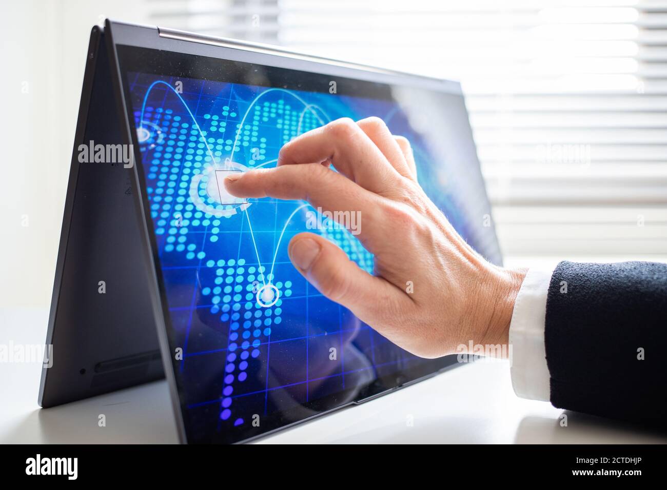 hand touching tablet screen global connection Stock Photo - Alamy