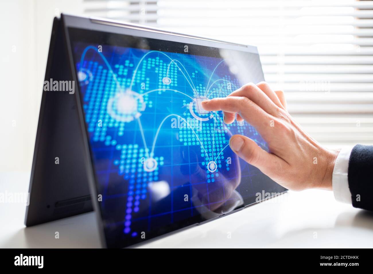 hand touching tablet screen global connection Stock Photo - Alamy