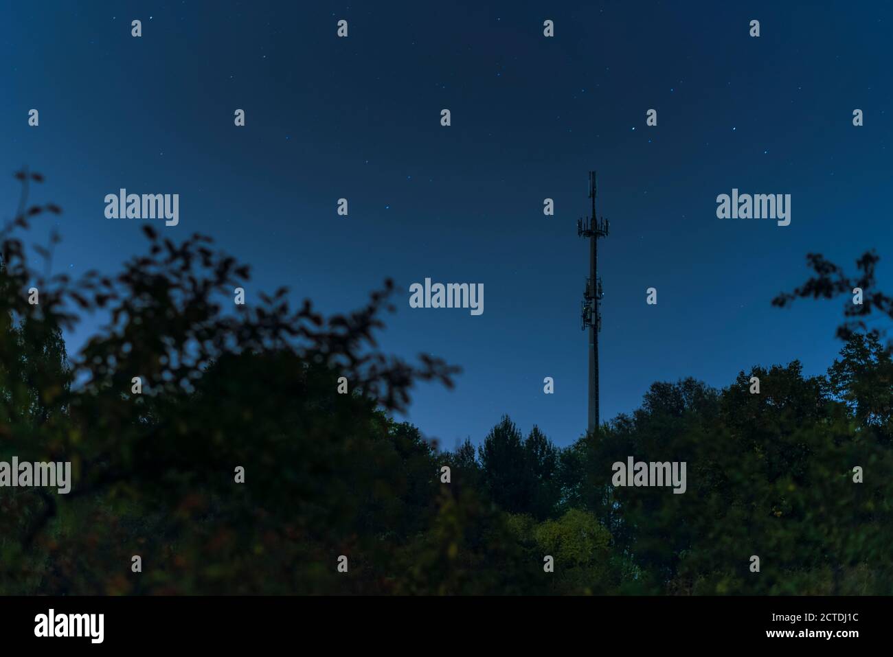 A cell tower at night with stars in the background, cell tower at night ...