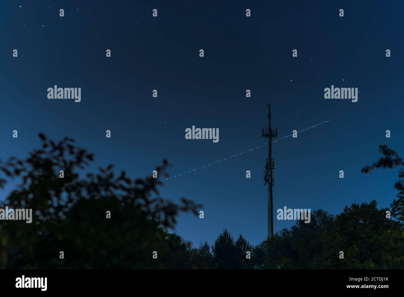 A cell tower at night with stars in the background, cell tower at night ...