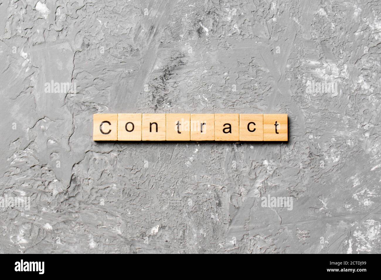 contract word written on wood block. contract text on table, concept ...