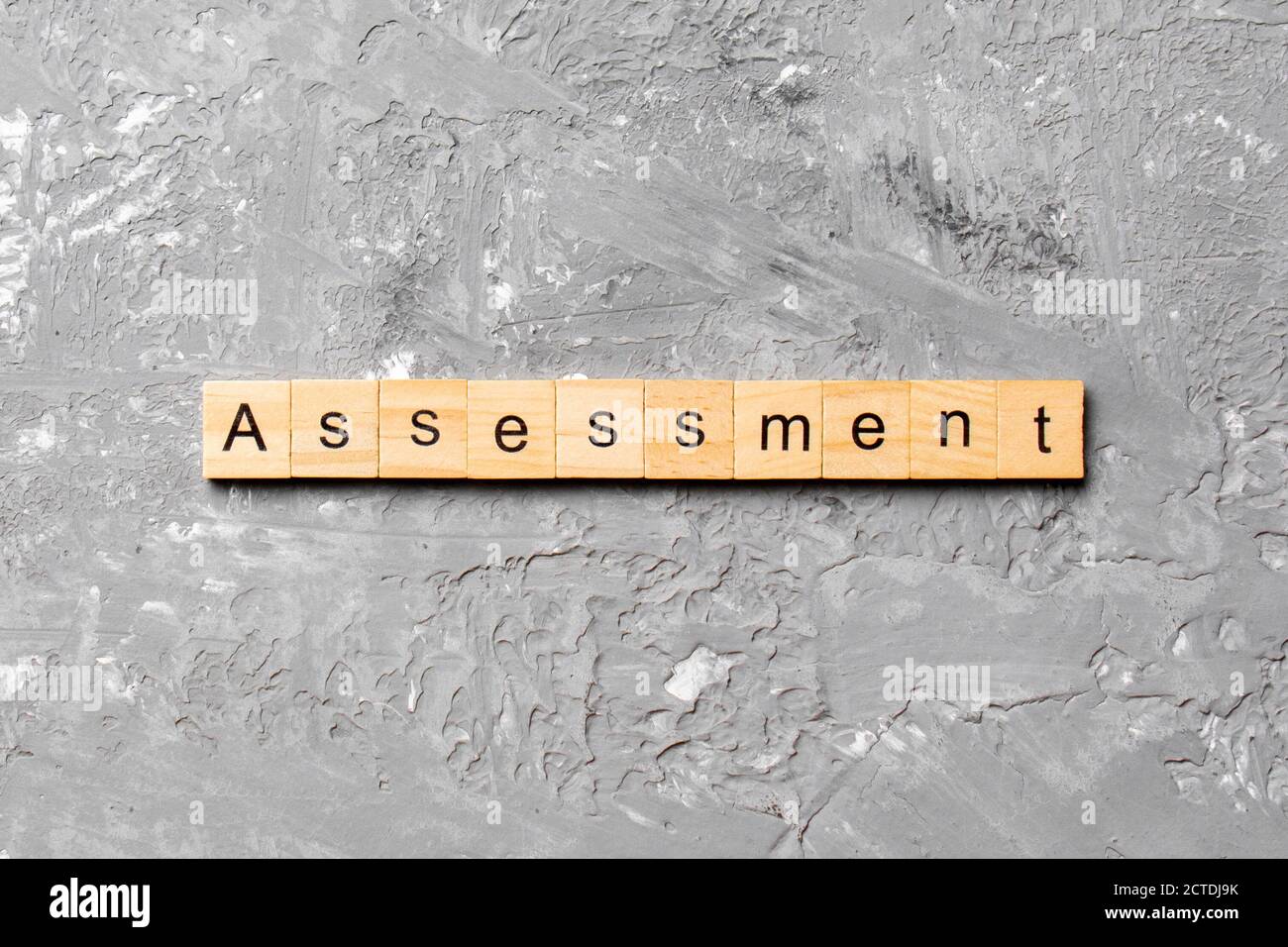 assessment word written on wood block. assessment text on table ...