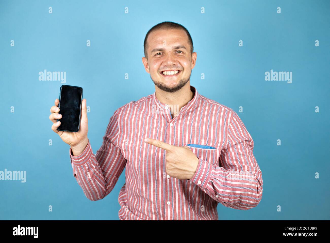 Russian business man over blue background having a conversation using ...