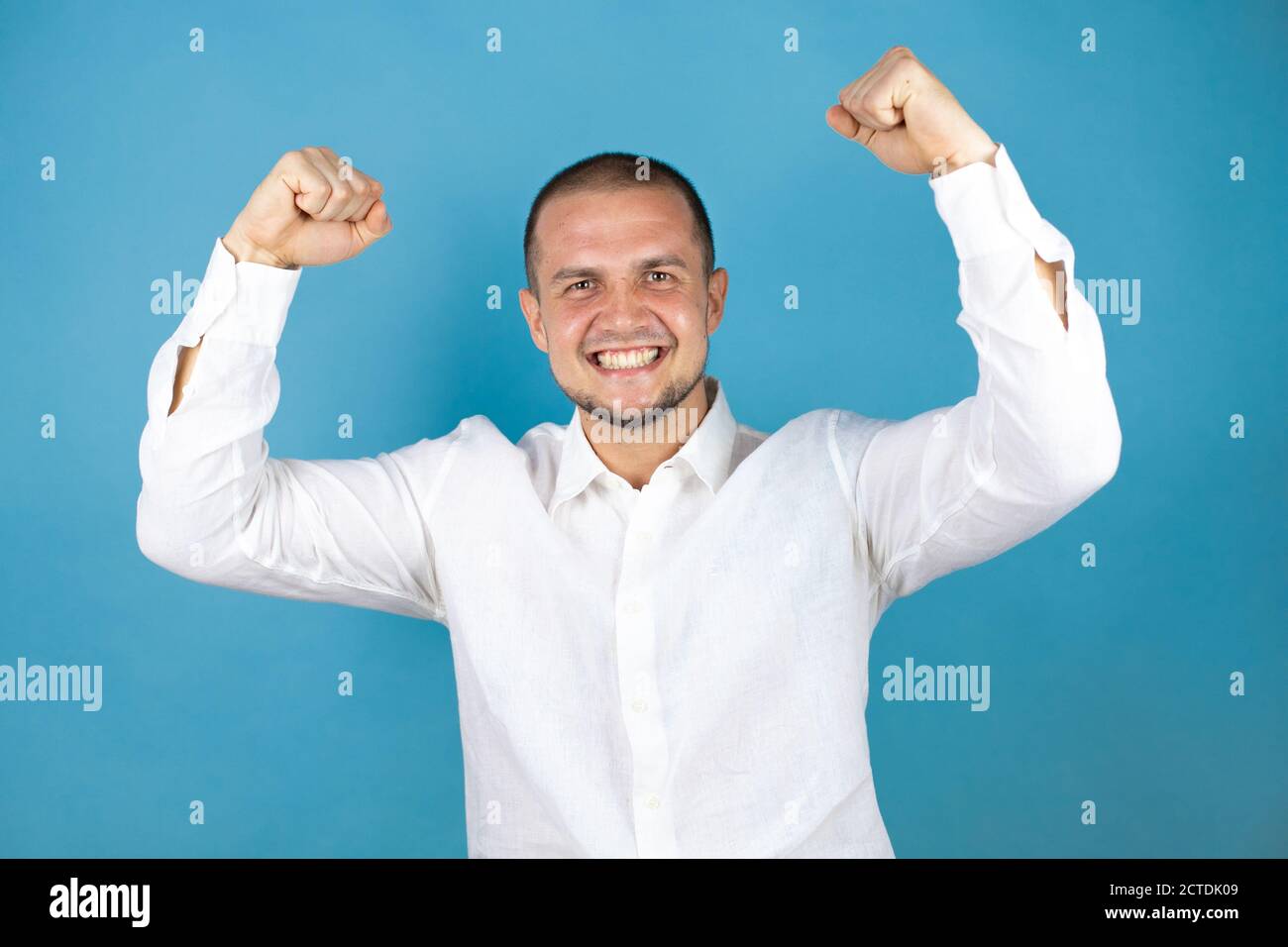 Russian business man wearing white shirt standing over blue background ...