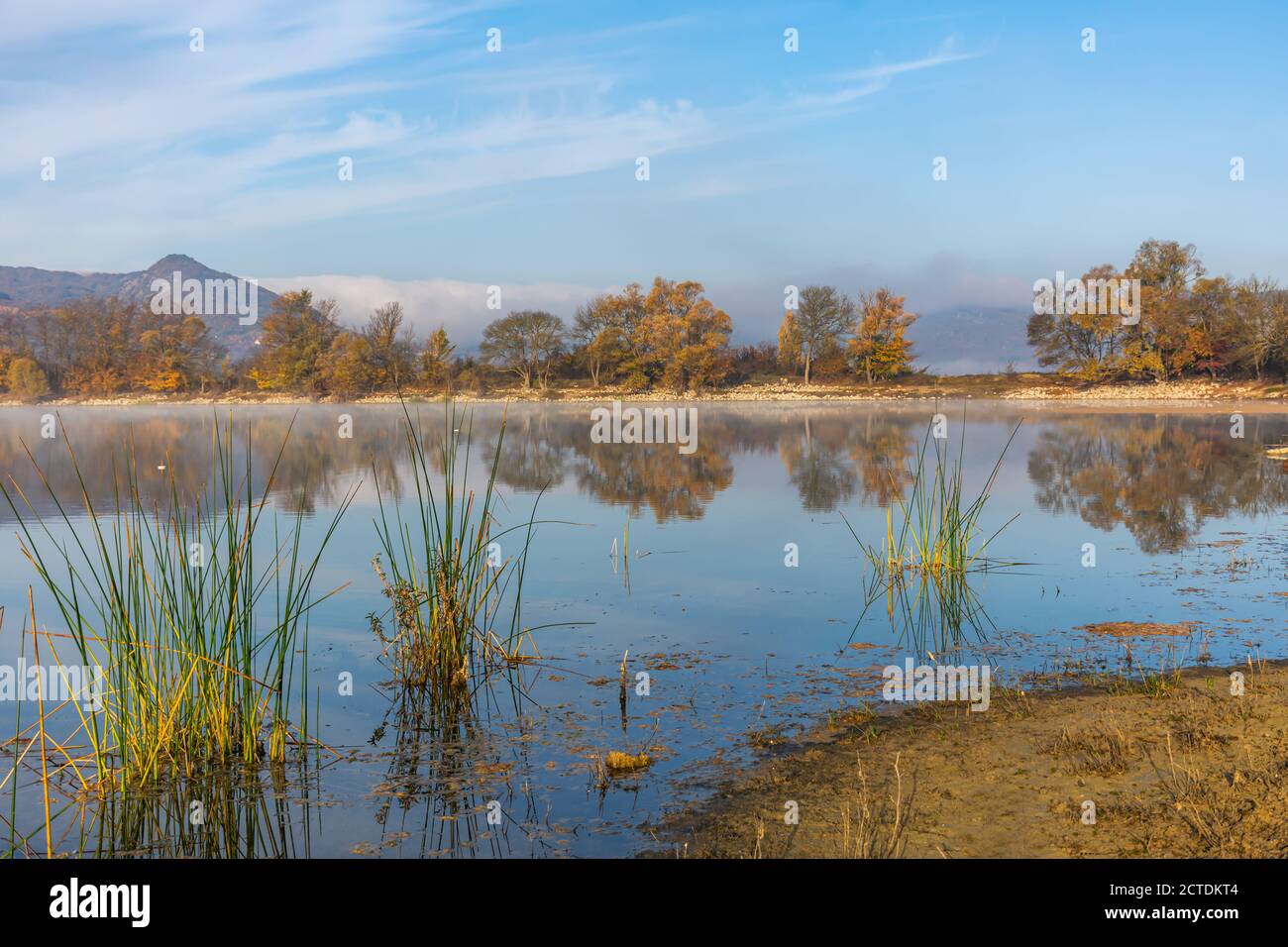 Beautiful autumn landscape with yellow trees and their reflection in ...