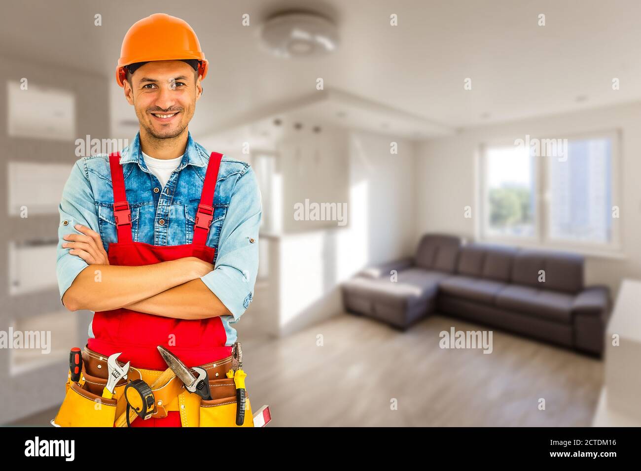 Builder handyman with construction tools. House renovation background ...