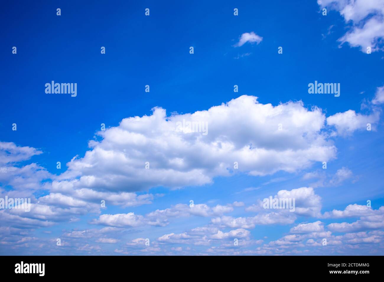 deep blue sky with clouds and silhouettes of flying birds, cloudy ...