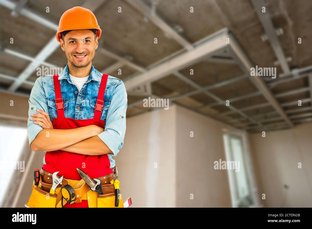 Builder handyman with construction tools. House renovation background ...