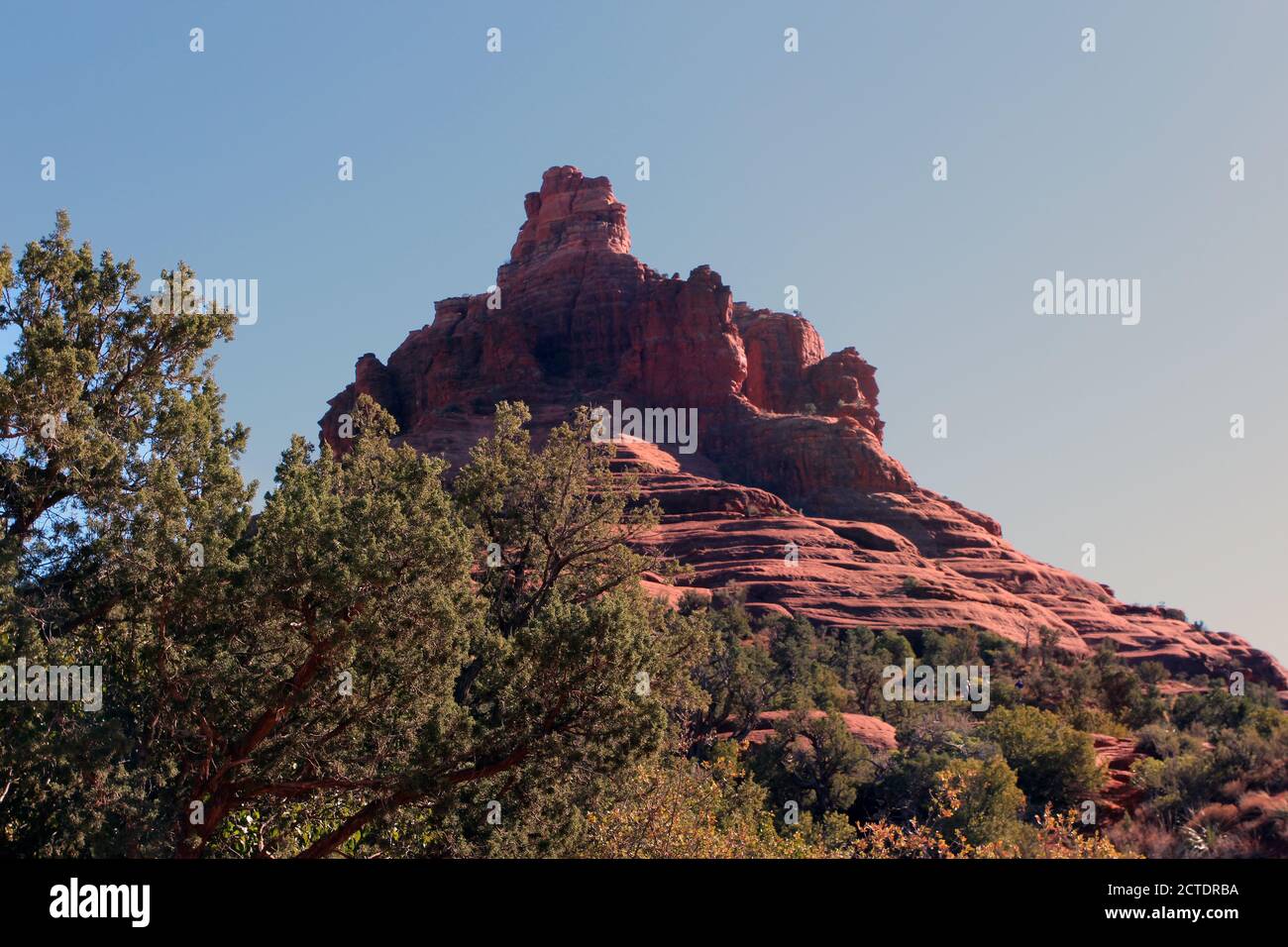 Bell Rock, a red sandstone mountain formation, in the late afternoon on ...