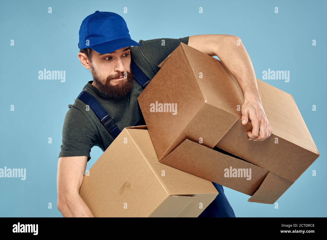 working man boxes in hands delivery service packaging lifestyle blue ...