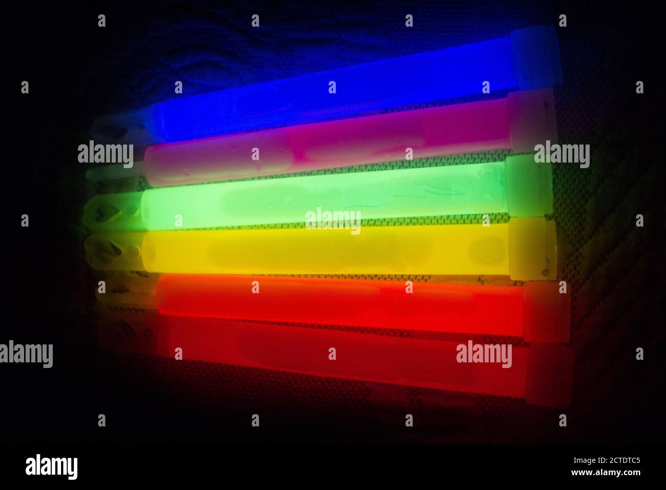 Rainbow Colors of Glow Sticks Stock Photo - Alamy