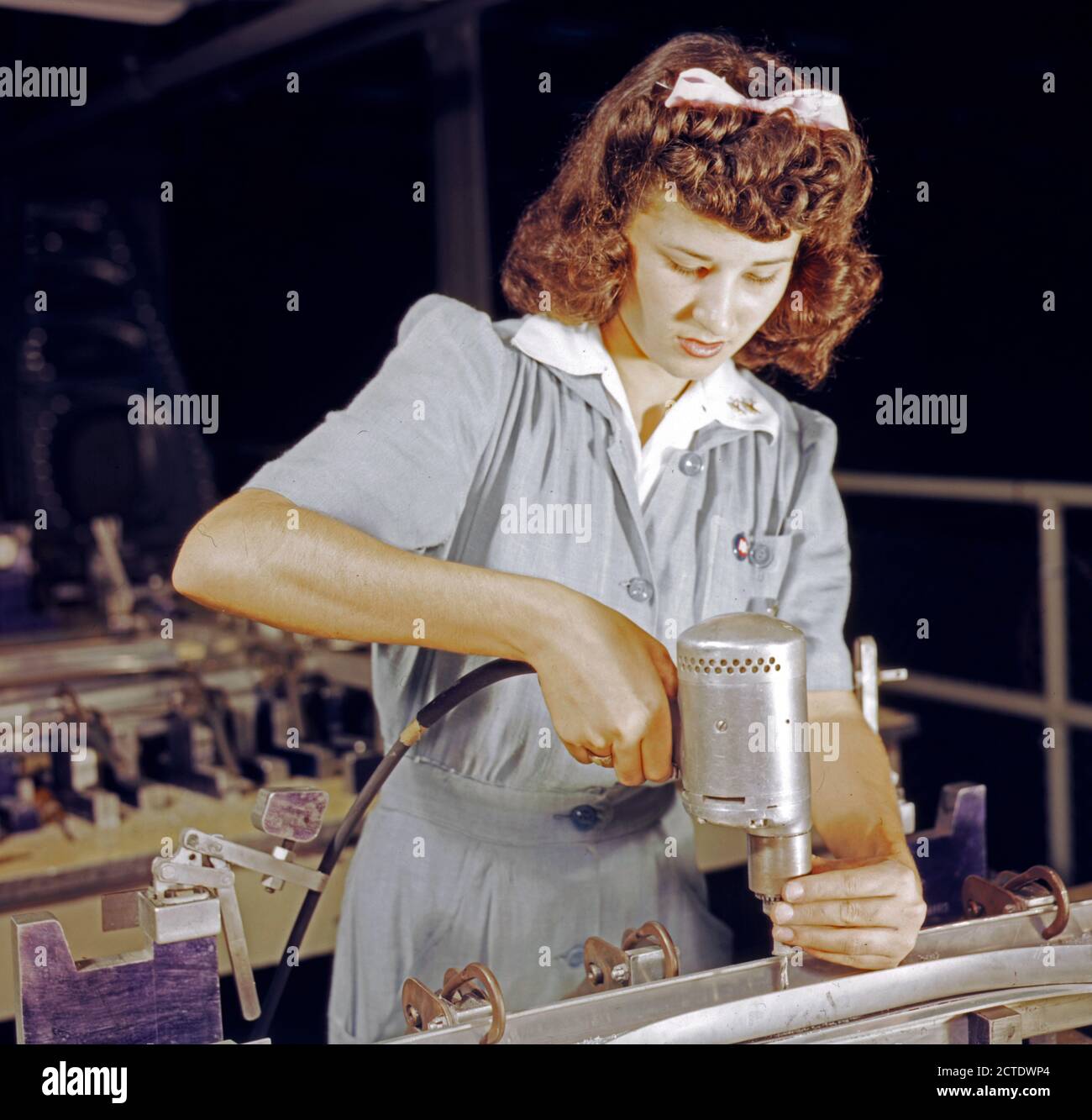 Drilling a wing bulkhead for a transport plane at the Consolidated ...
