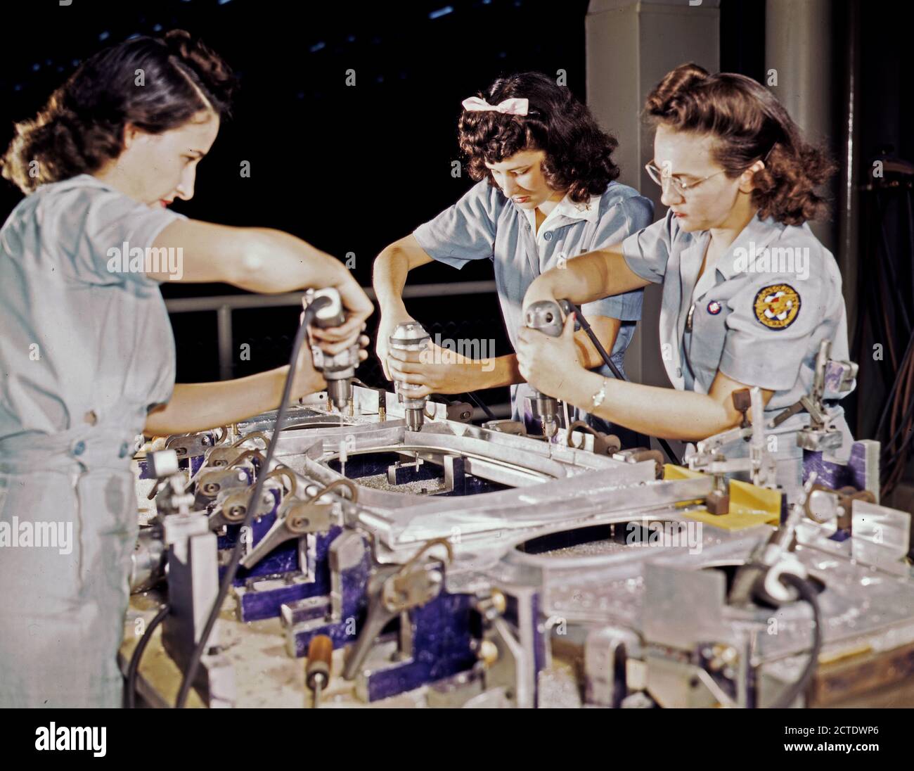 Drilling a wing bulkhead for a transport plane at the Consolidated ...