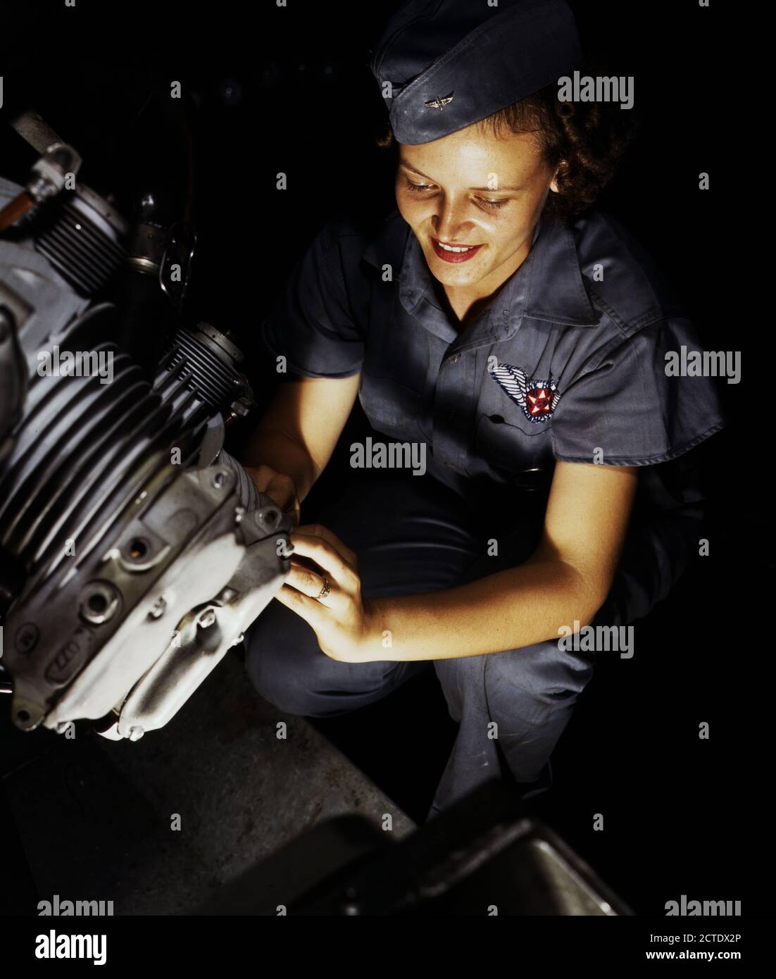 Assembly and Repairs Department woman mechanic works on a Wright ...