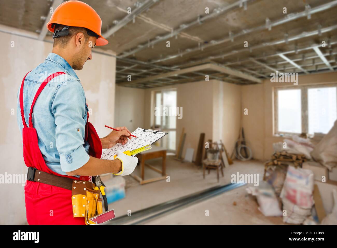 Builder handyman with construction tools. House renovation background ...