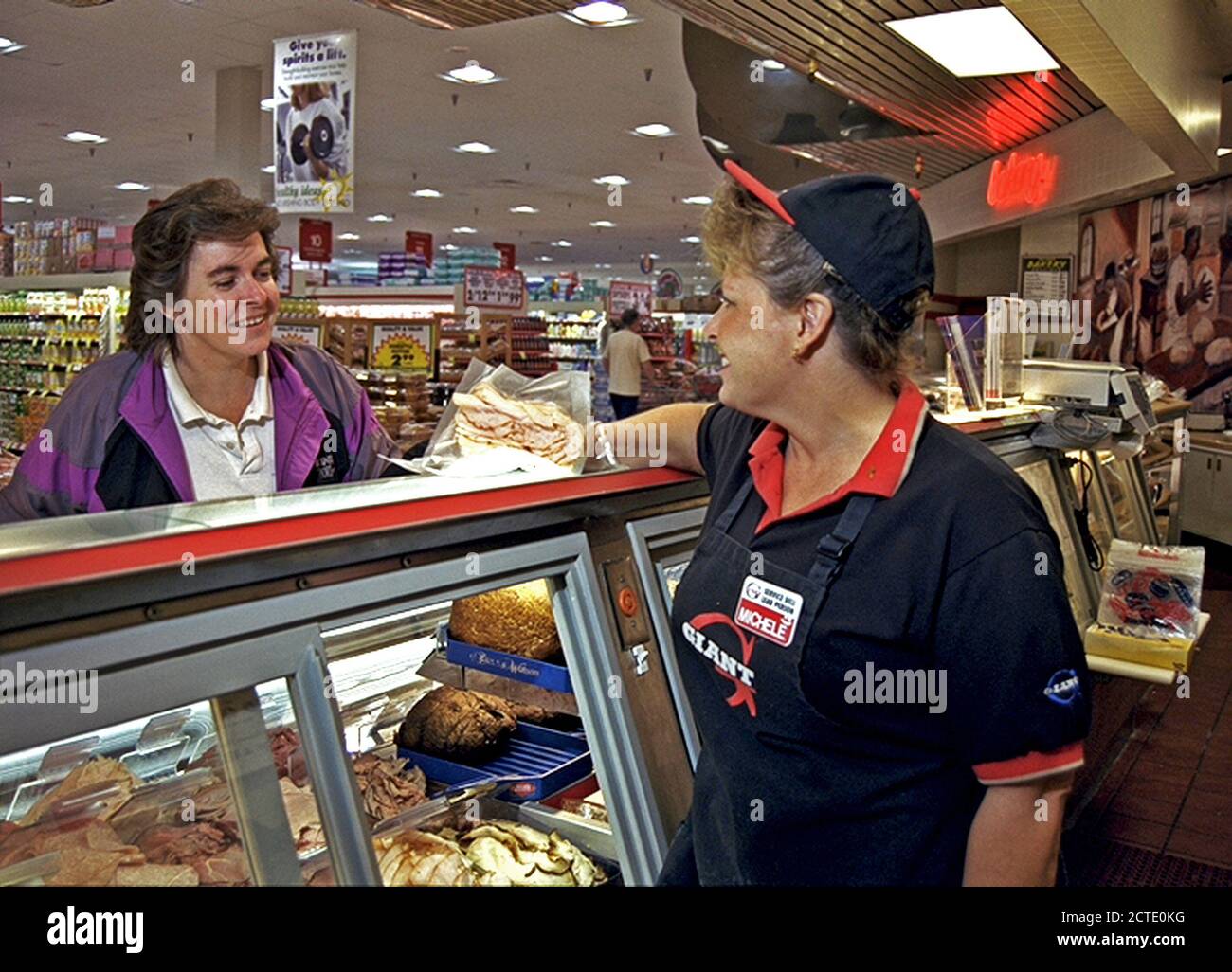 June 2000 - Shopper At Deli Section In Grocery Store Stock Photo - Alamy