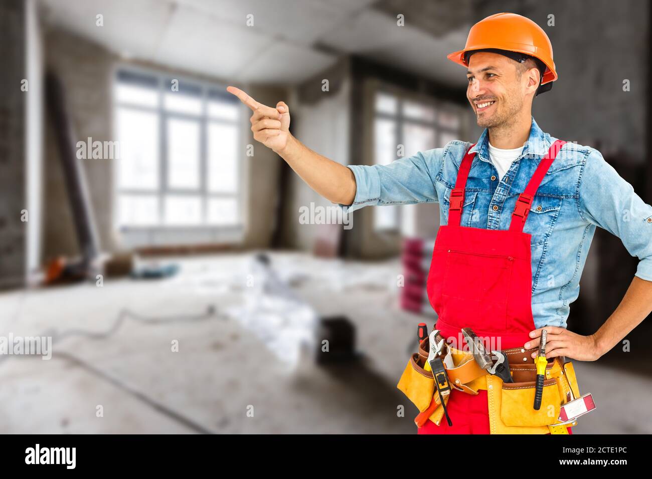Builder handyman with construction tools. House renovation background ...