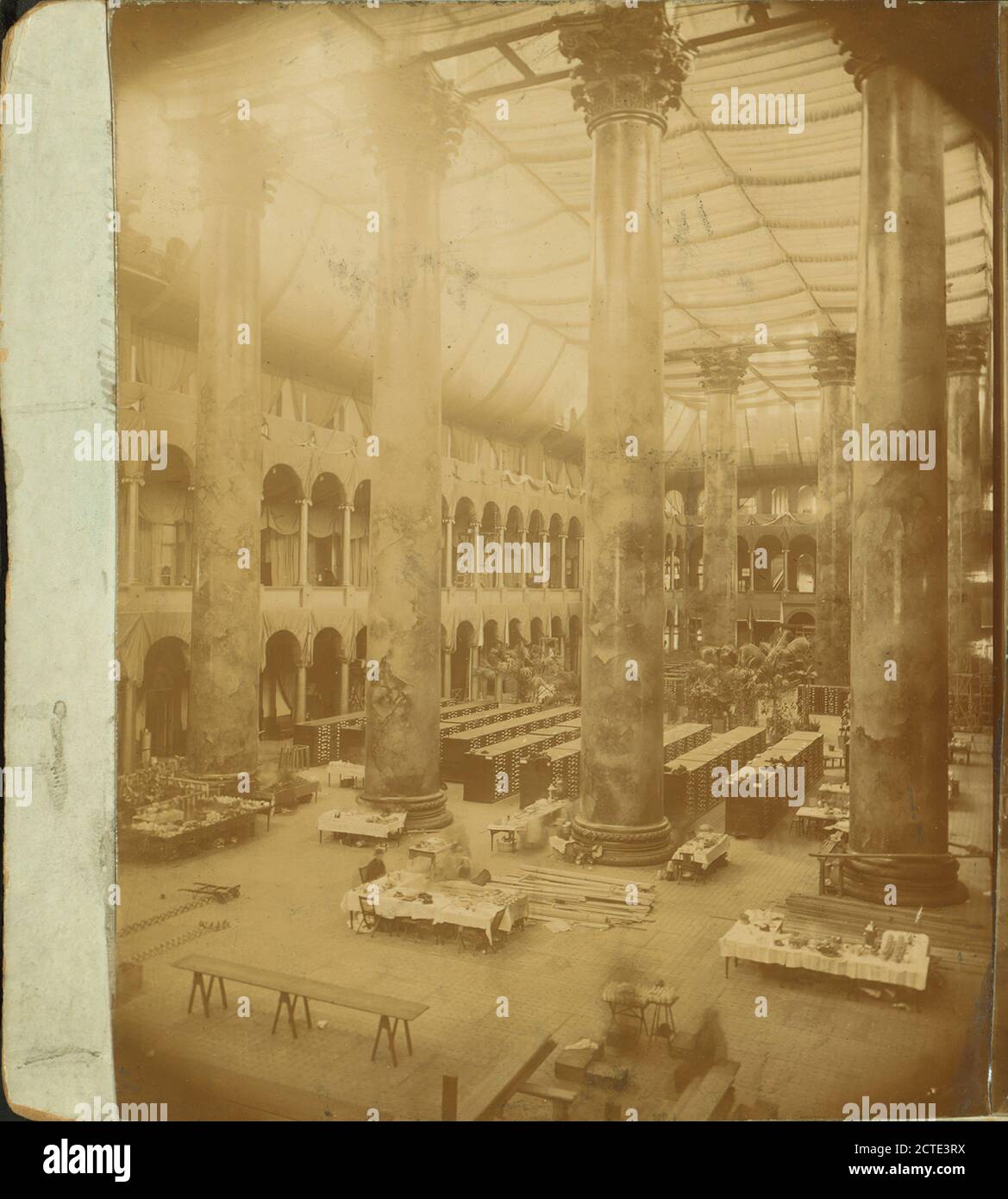 A view of the Pension building with tables set up for a reception ...