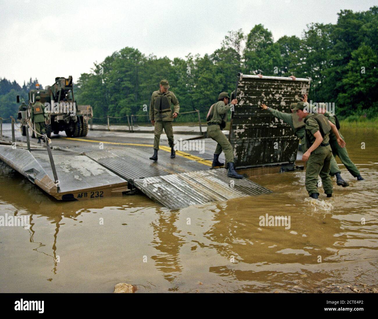 1978 - A ribbon bridge is assembled by members of the 1457th Engineer ...