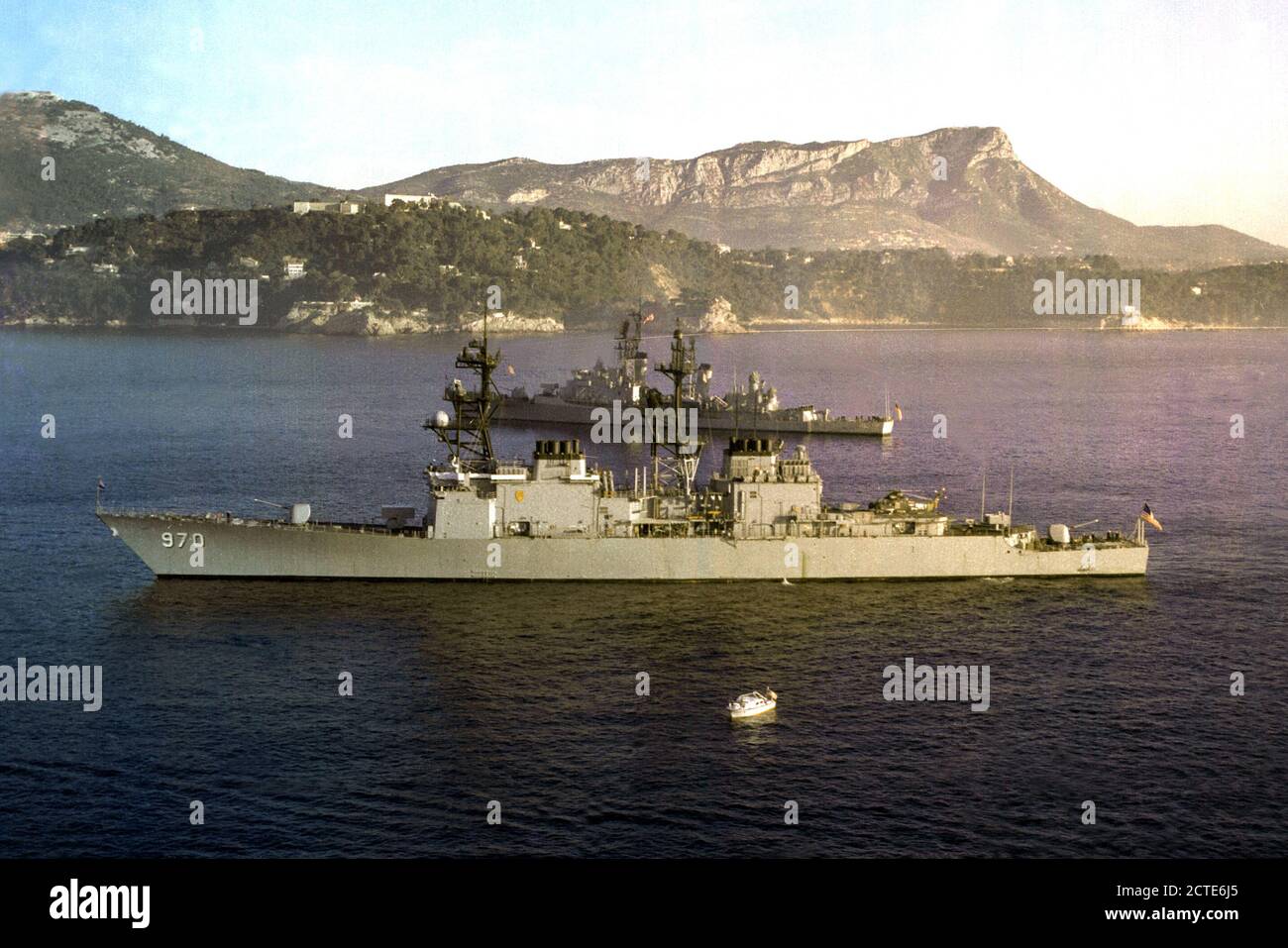 1979 - A port view of the destroyer USS CARON (DD-970) and the guided ...