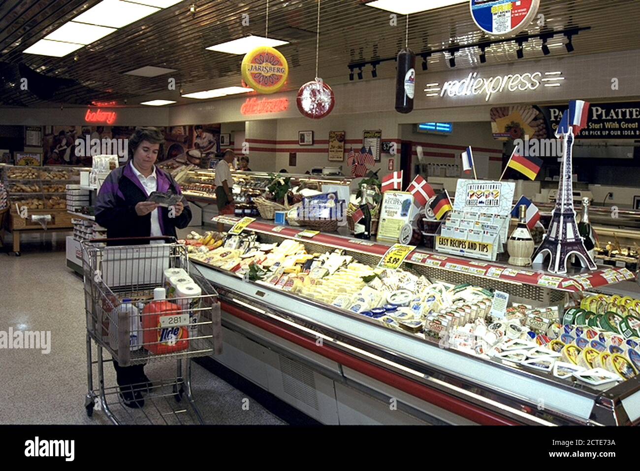 June 2000 - Shopper In Cheese Section Of Grocery Store Stock Photo - Alamy