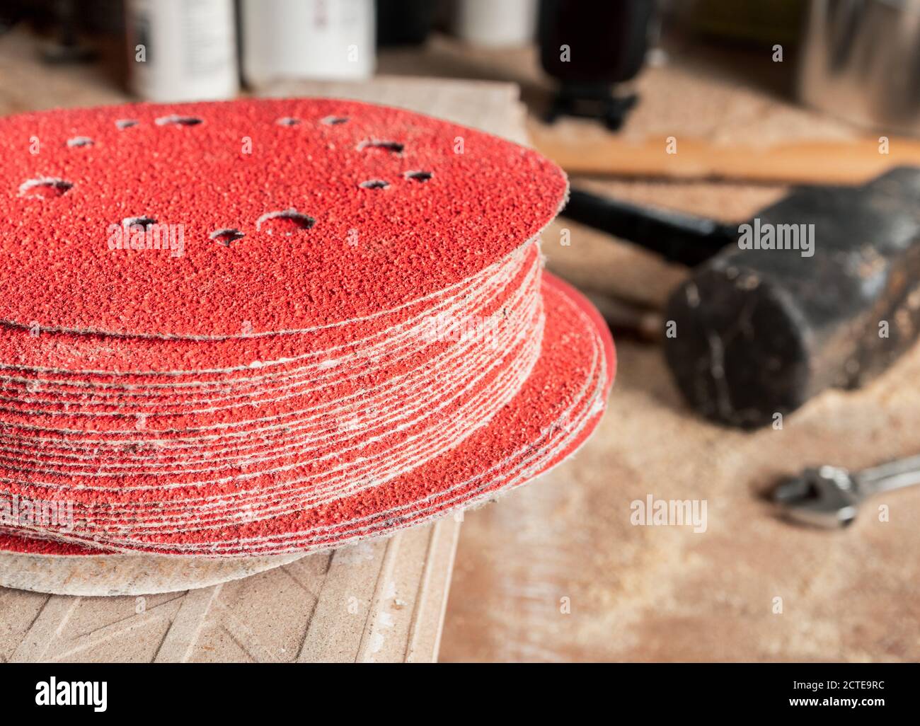 Multiple sanding pads for grinder or drill on workshop table ...