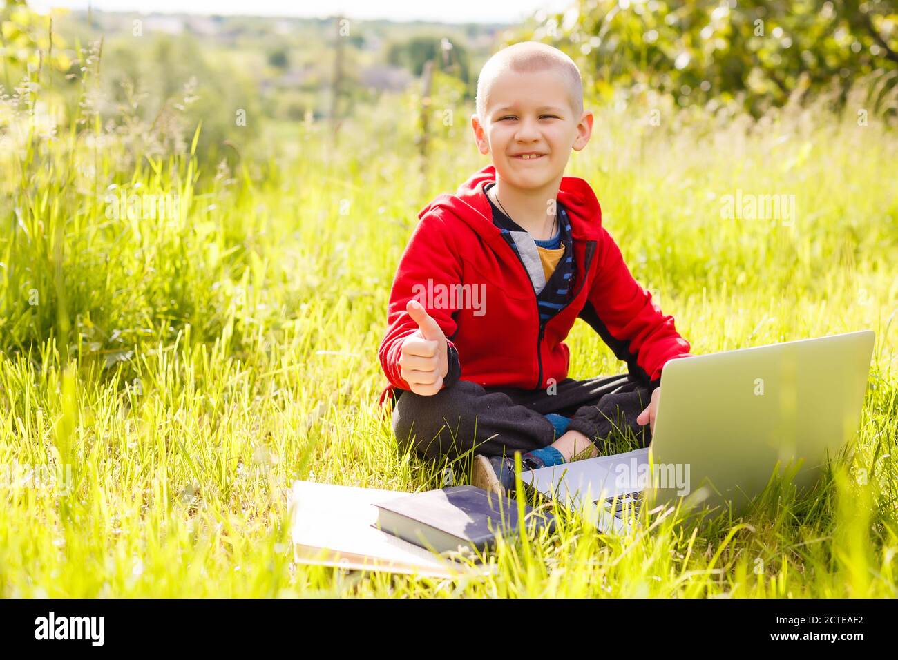 Children, education, learning, technology concept. Little boy with ...