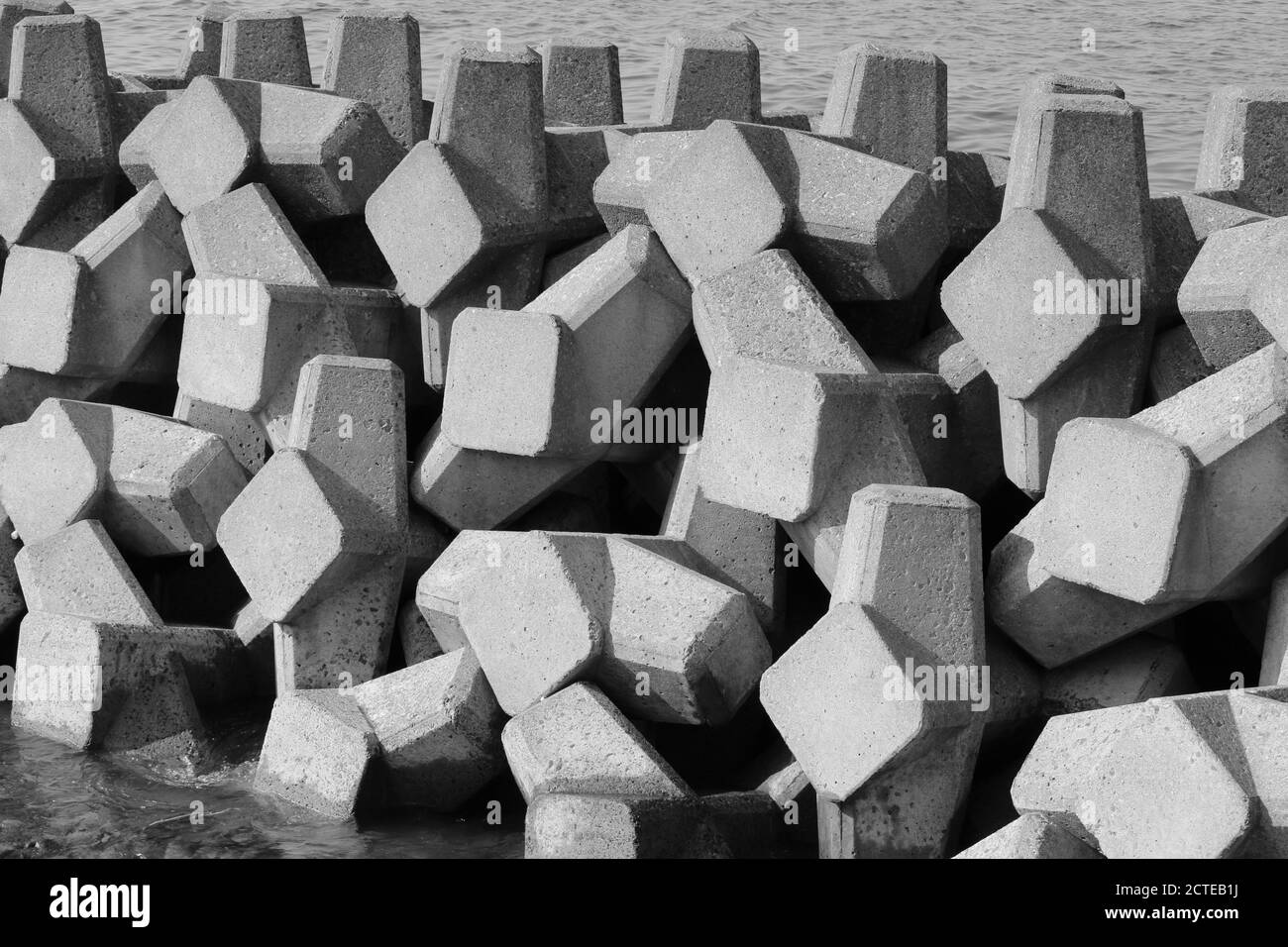 Full-frame close up concrete blocks along coast Stock Photo - Alamy