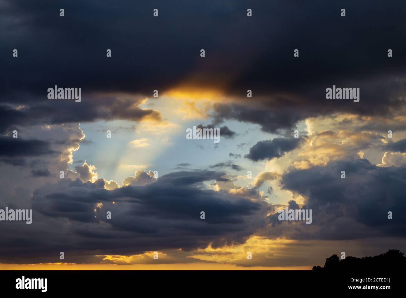 Sunbeam from the dark storm cloud. Weather concept Stock Photo - Alamy