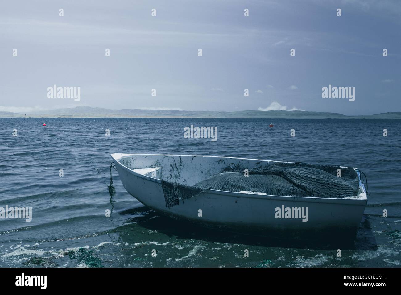 Boat in the sea blue colored Stock Photo - Alamy
