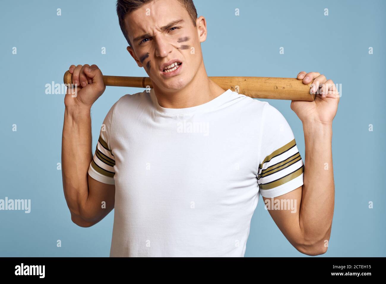 baseball guy with a bat in his hand on a blue background and a combat ...