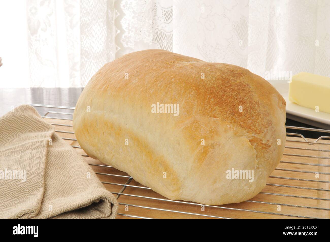 A loaf of hot homemade bread cooling by the window Stock Photo - Alamy