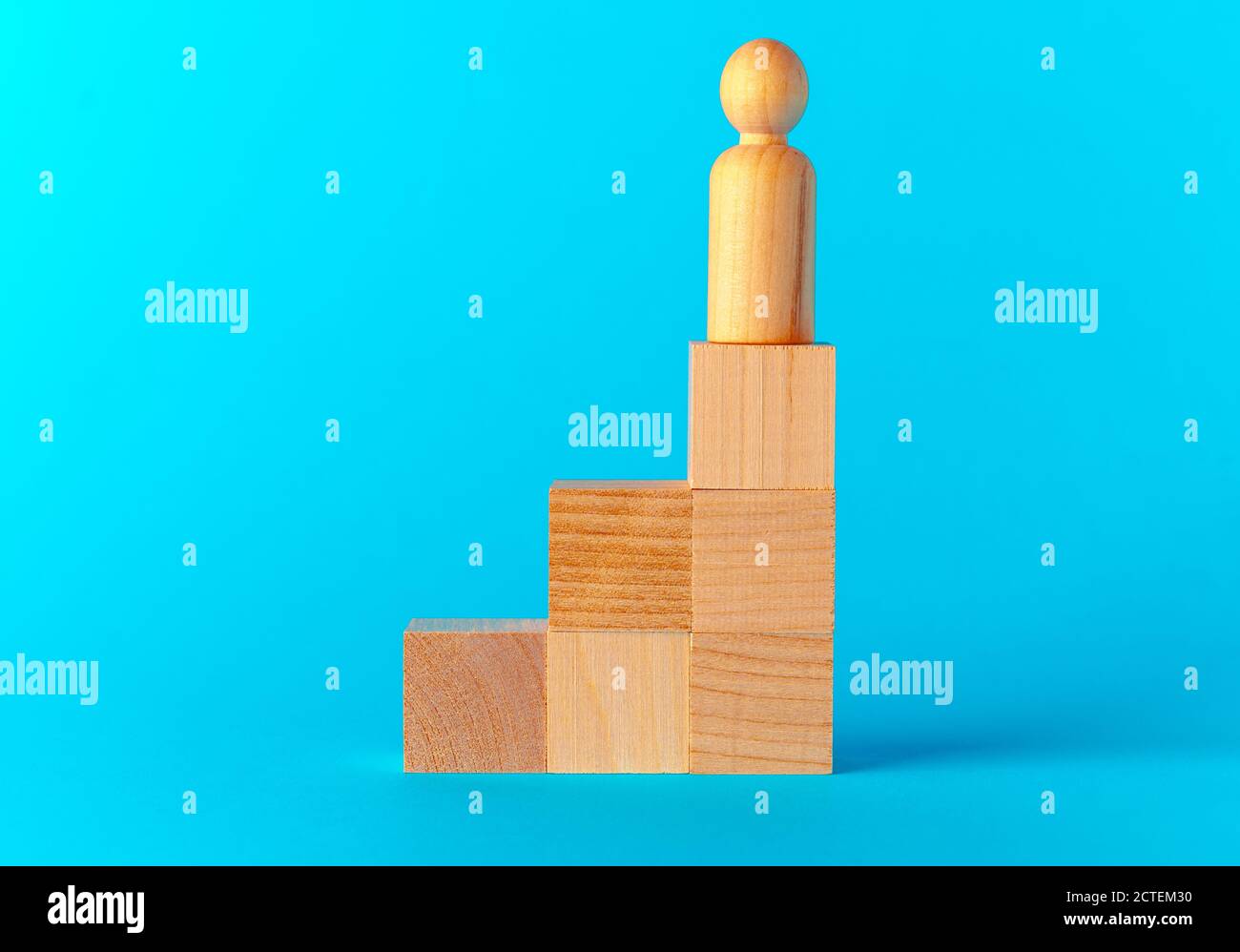 Toy wooden blocks on blue background front view Stock Photo - Alamy