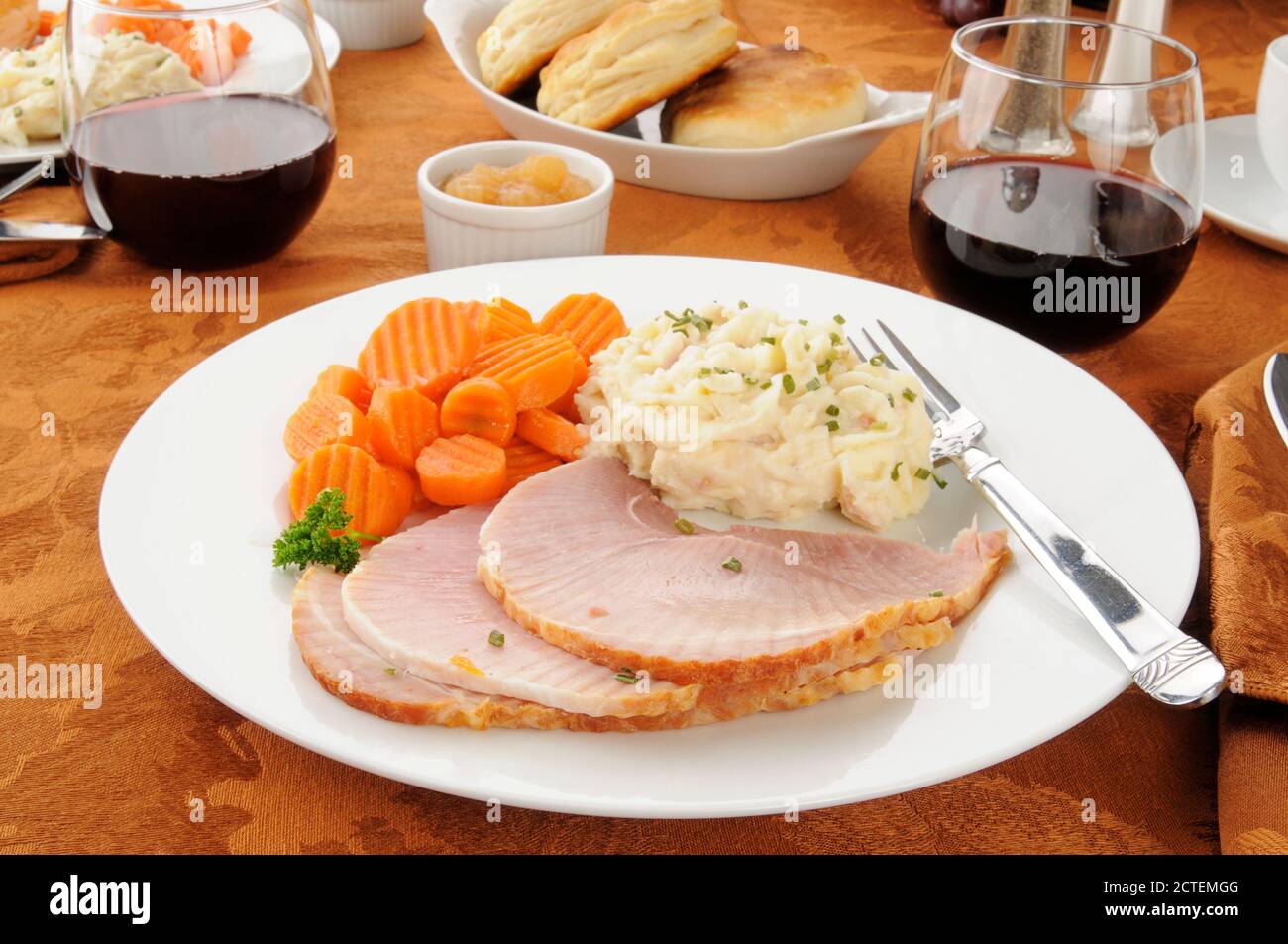 A holiday ham dinner with mashed potatoes and red wine Stock Photo - Alamy