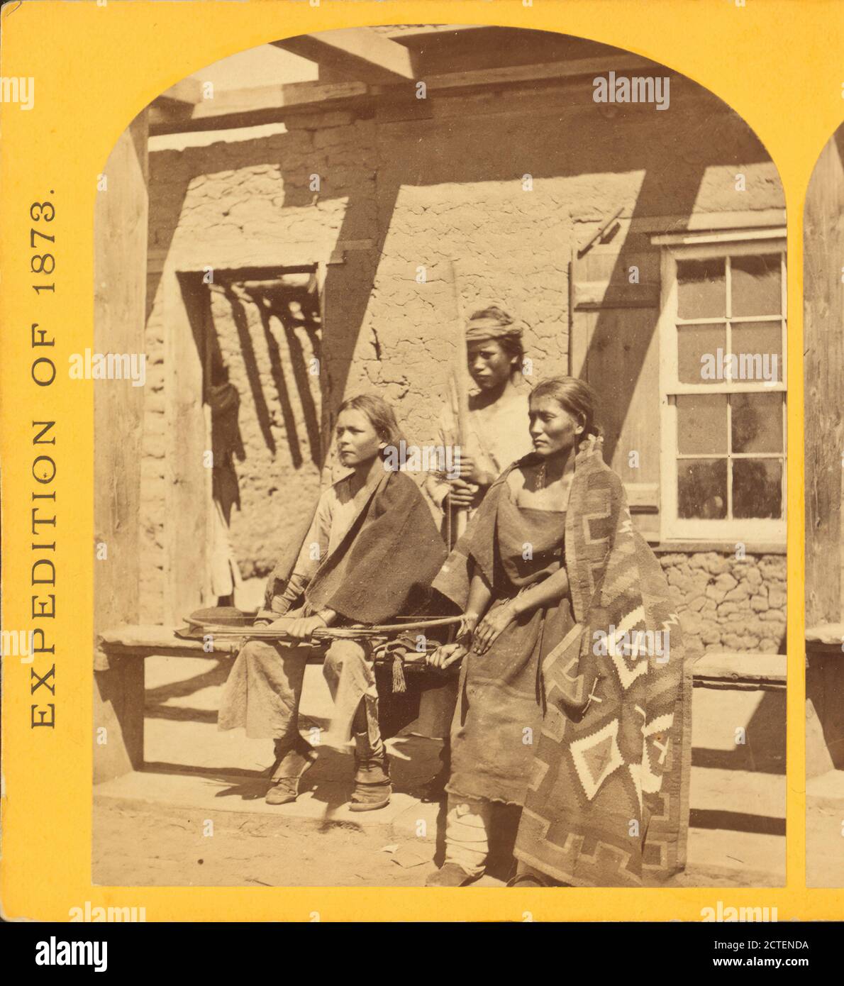 Navajo boys and squaw, in front of the quarters at old Fort Defiance, N ...
