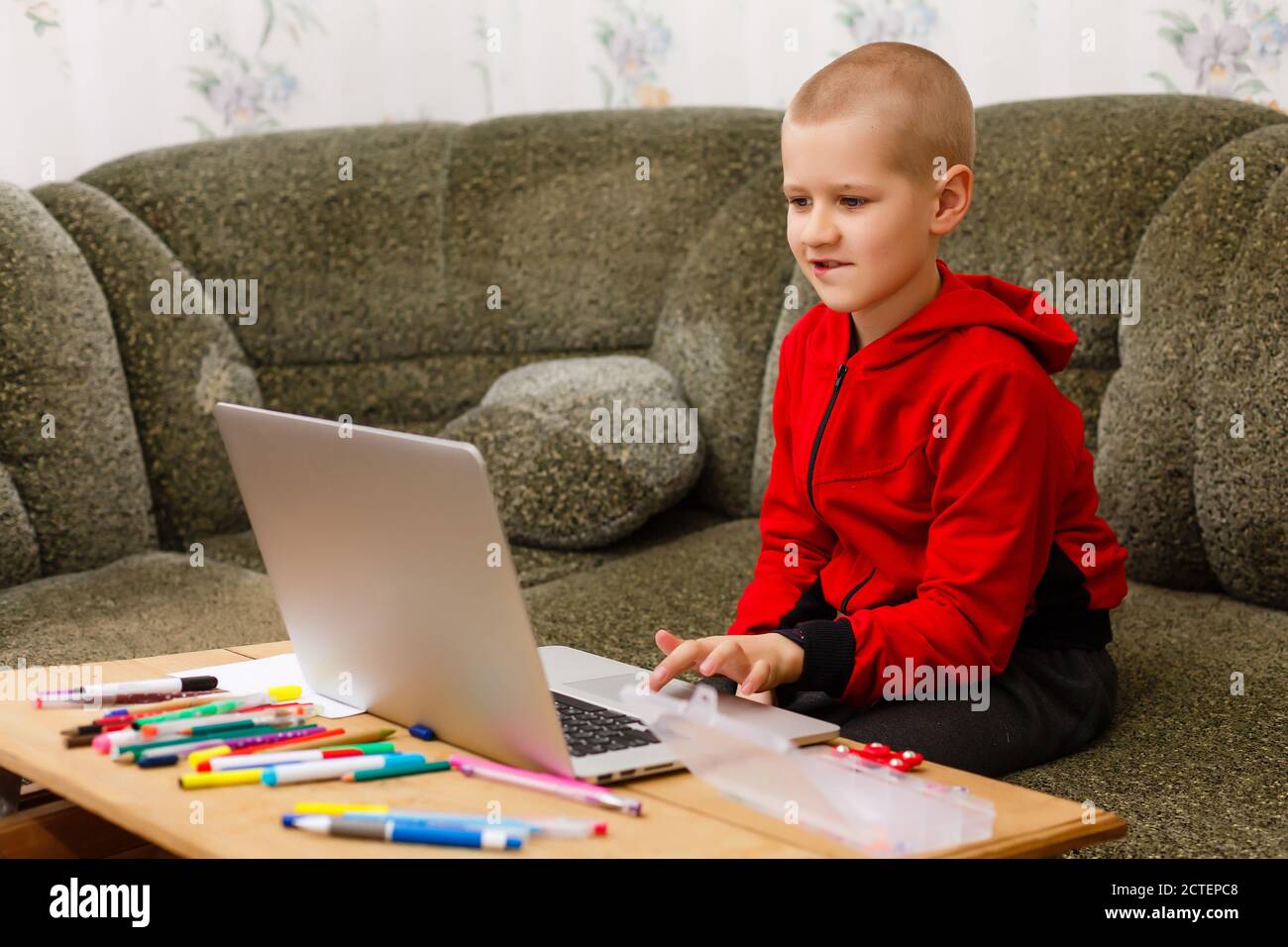 Young boy doing homework at the table at home Stock Photo - Alamy