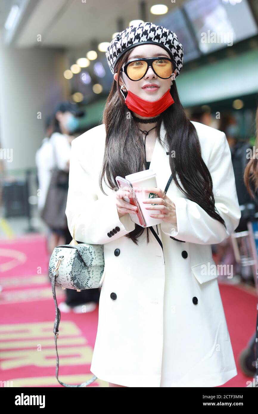 Chinese singer and actress Flora Dai Yanni arrives at a Beijing airport ...