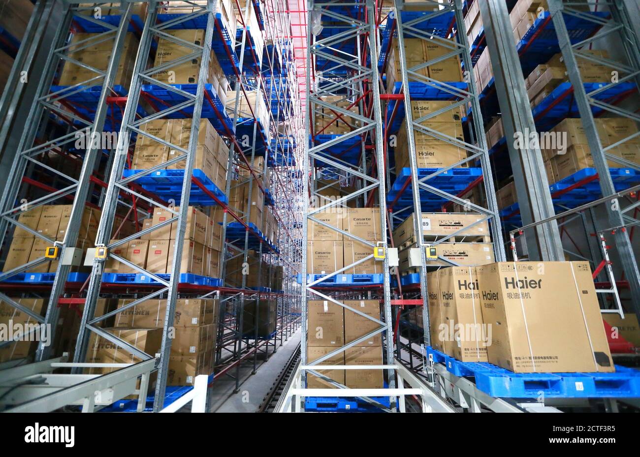 Large and bulky boxes are delivered at an unmanned smart warehouse ...