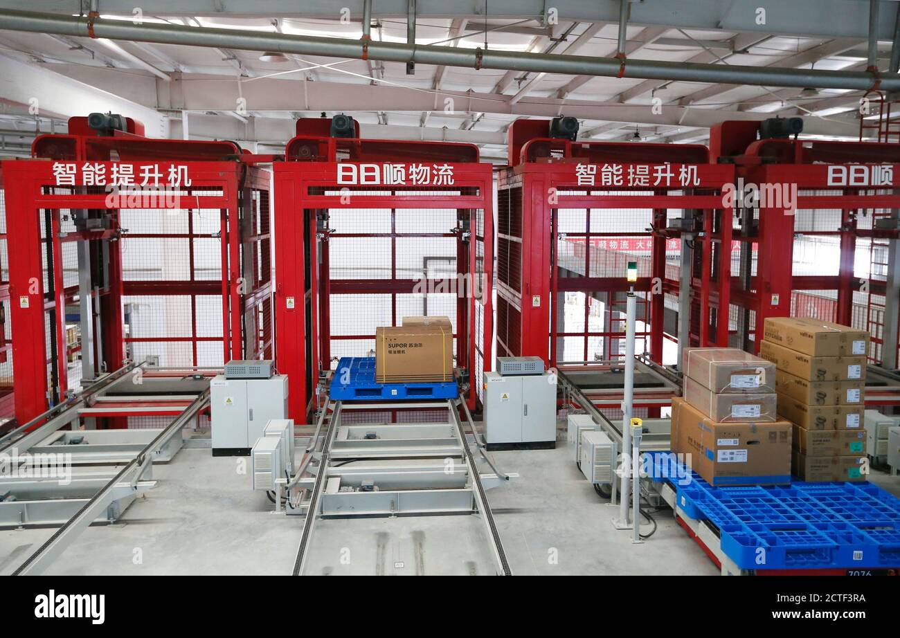 Large and bulky boxes are delivered at an unmanned smart warehouse ...