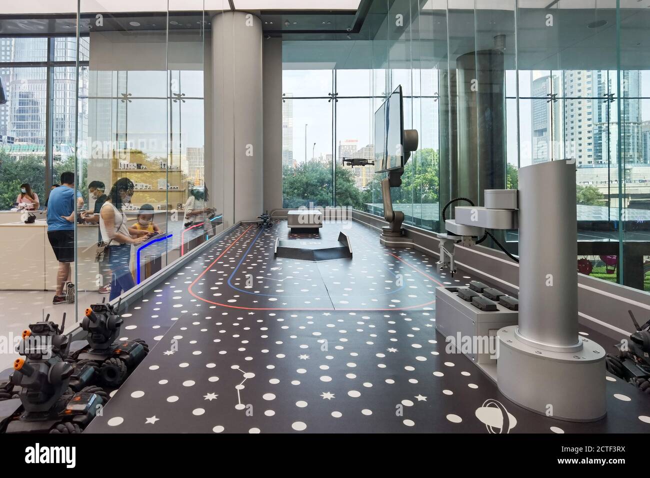 Customers experience products at the newly opened DJI flagship retail ...